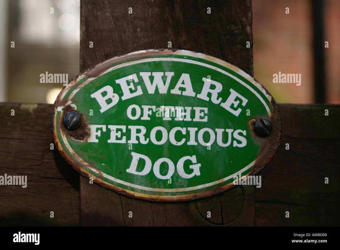 Beware of the Ferocious Dog Sign on a garden gate close up Stock Photo ...