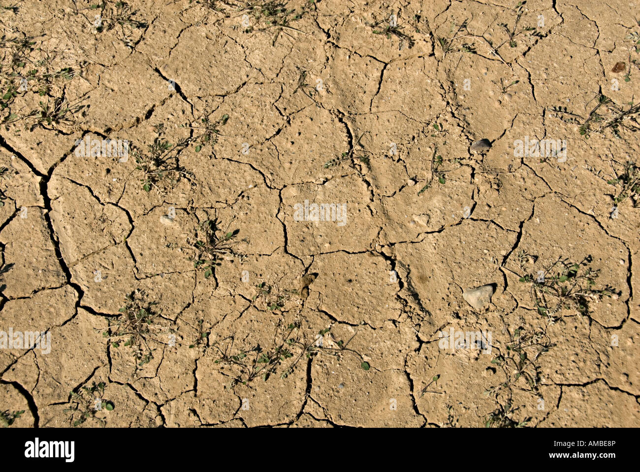 piles of rock mud and stone on the dry shores of lac de montbel in the ...