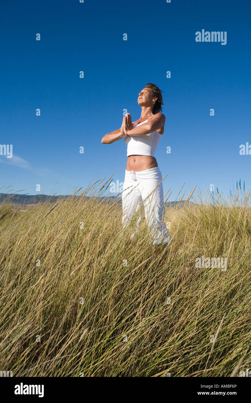 young woman in spiritual practise with hands in praying position Stock ...