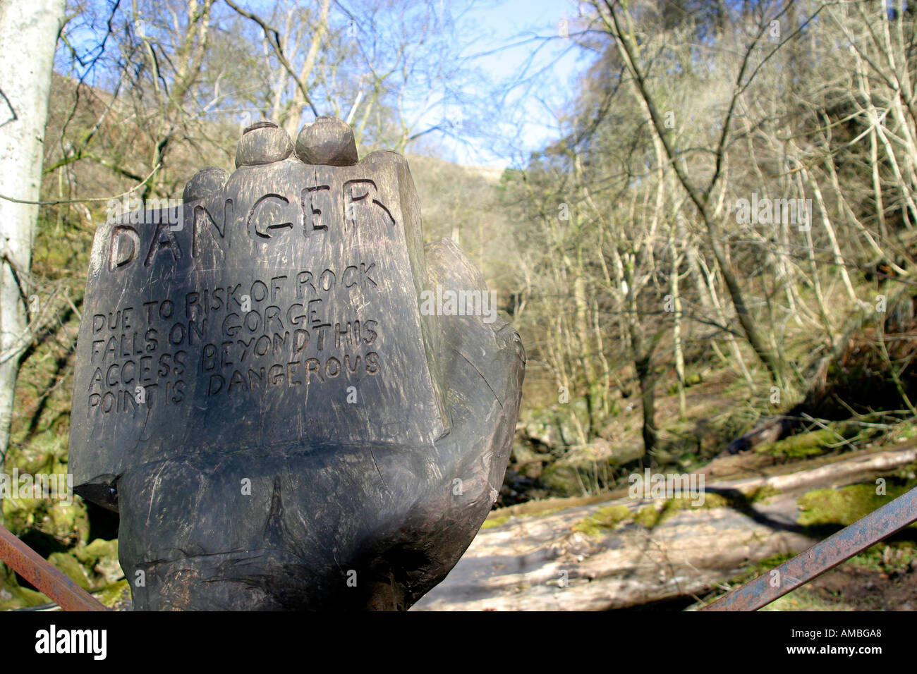 Warning sign carved from tree stump Stock Photo - Alamy