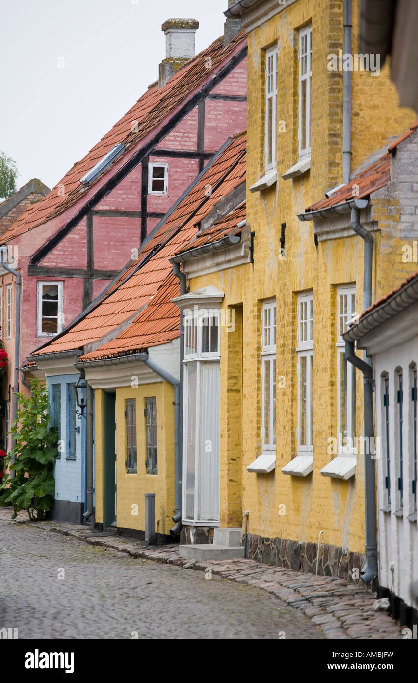 Curved Aero Streetscape A curved cobblestone street lined brightly ...