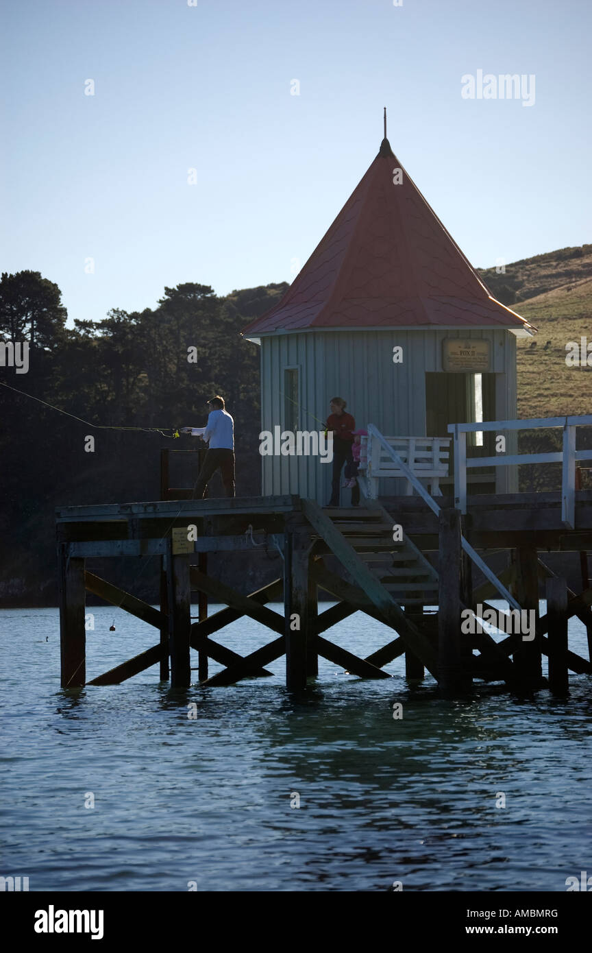 People fishing of a Jetty Akaroa New Zealand Stock Photo - Alamy