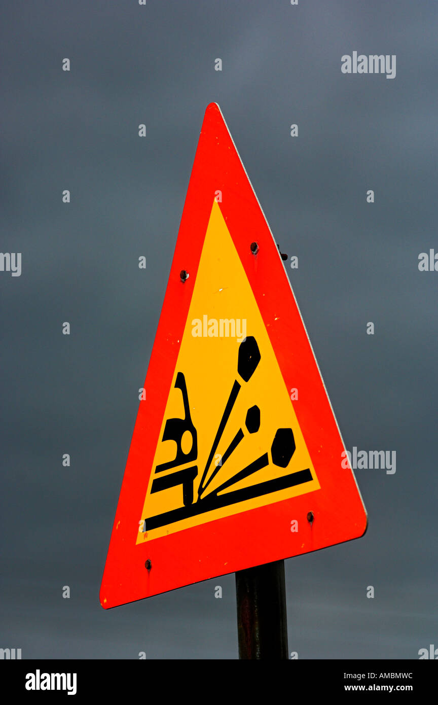 Loose chippings warning sign Stock Photo - Alamy