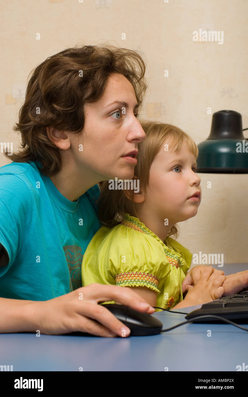 Looking closely at a computer screen hi-res stock photography and ...