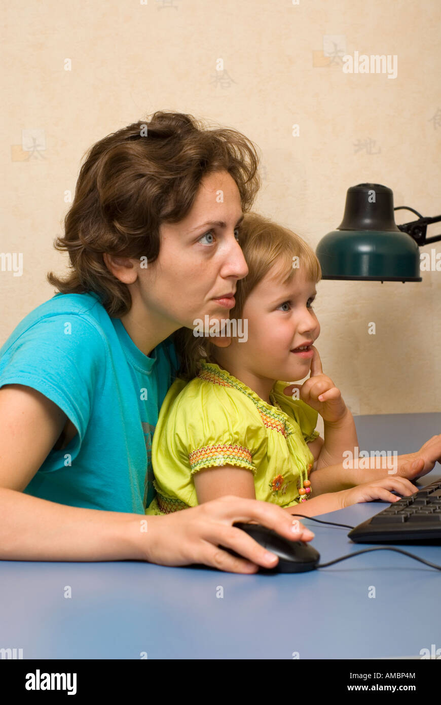 Looking closely at a computer screen hi-res stock photography and ...