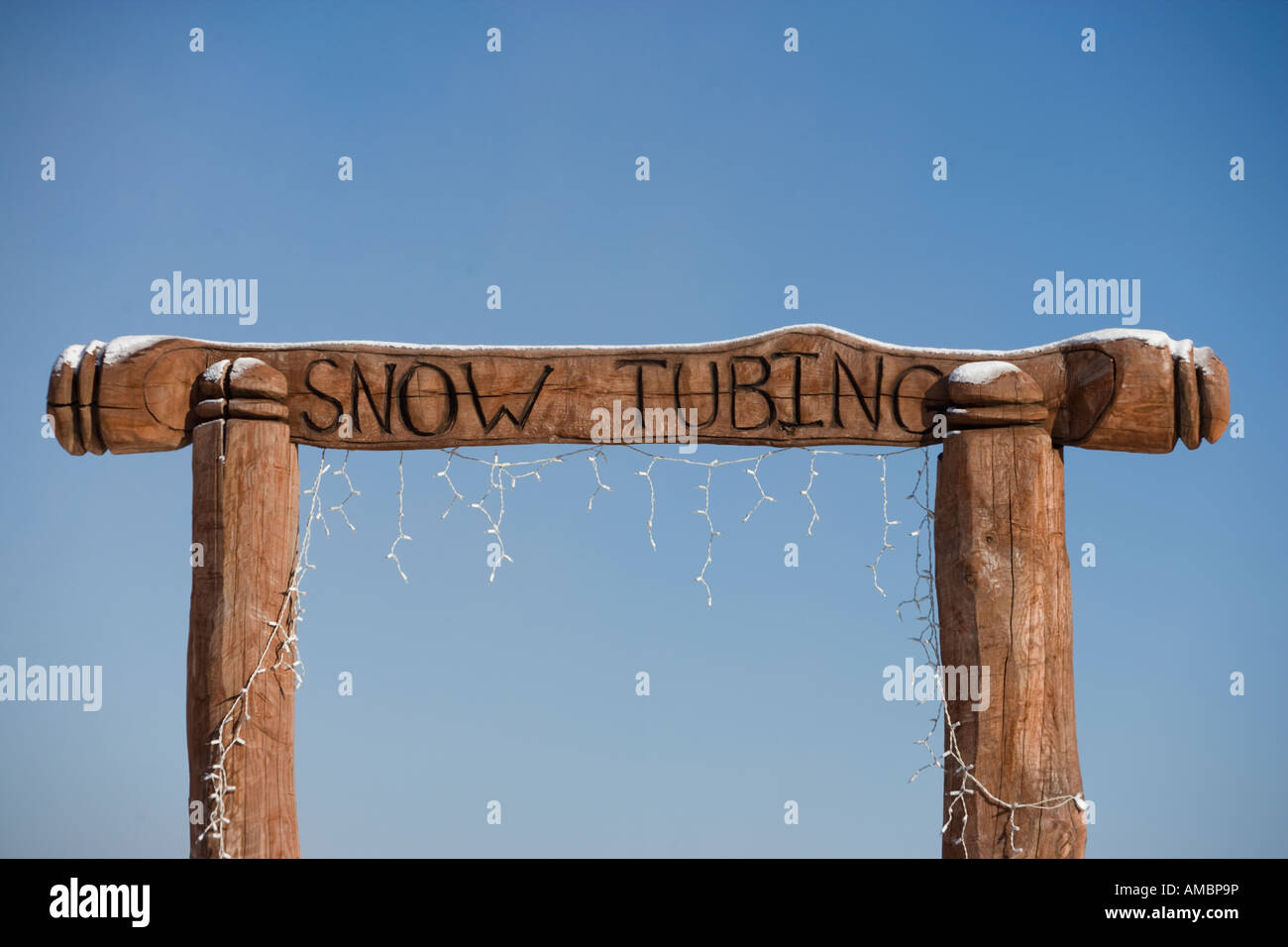 Sign allowing snow tubing Stock Photo - Alamy