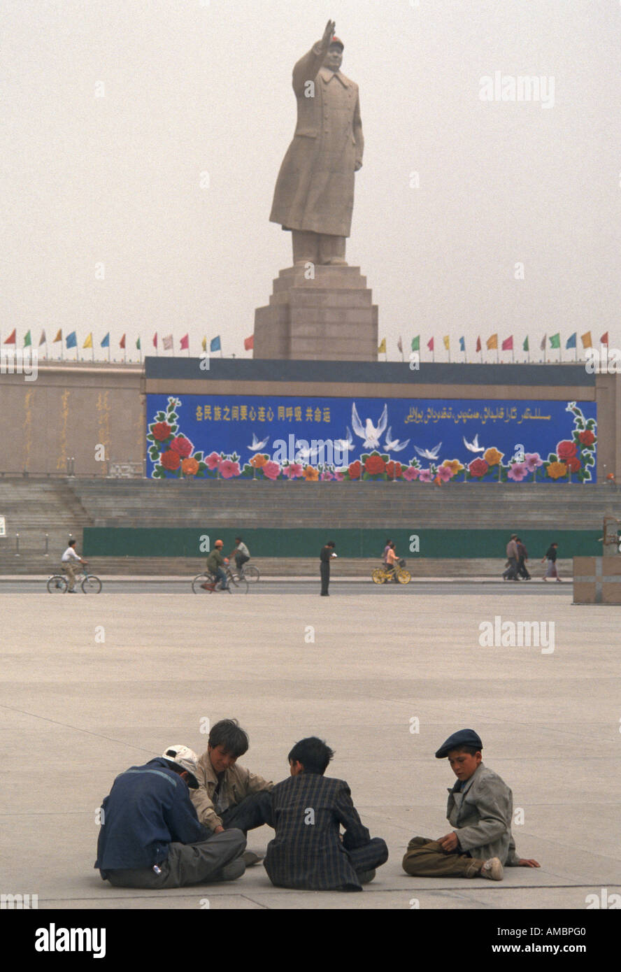 local children amusing themselves in square in Kashgar, Xinjiang, China ...
