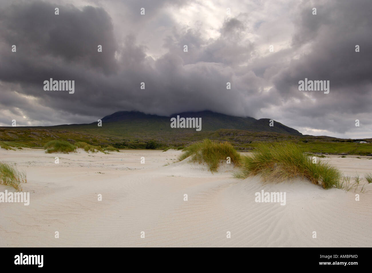 Sand dunes of Silver Strand beach with Mweelrea mountain in the ...
