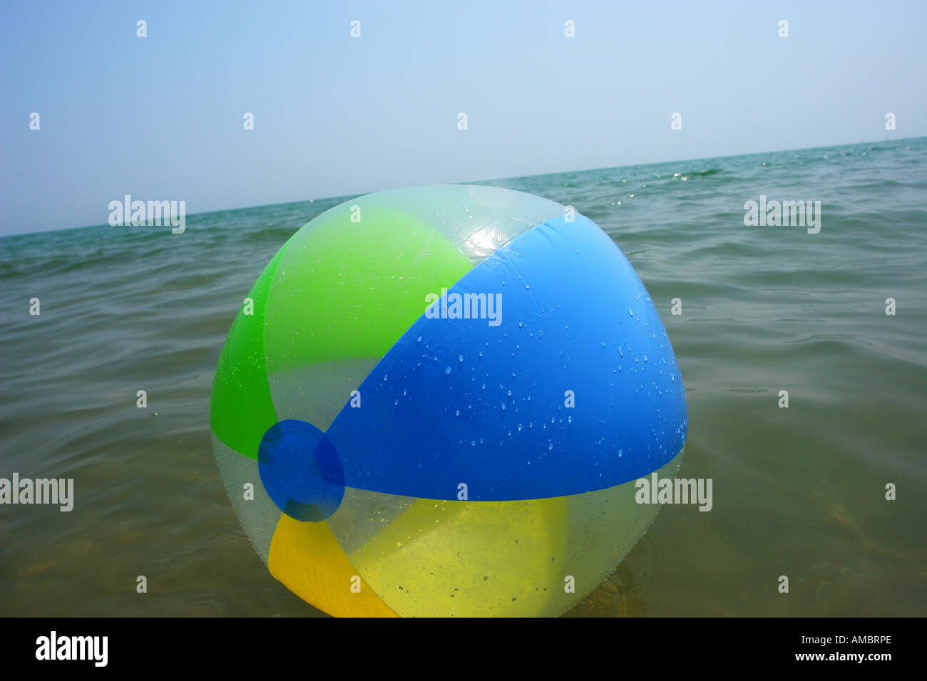 Beach ball at the ocean Stock Photo - Alamy