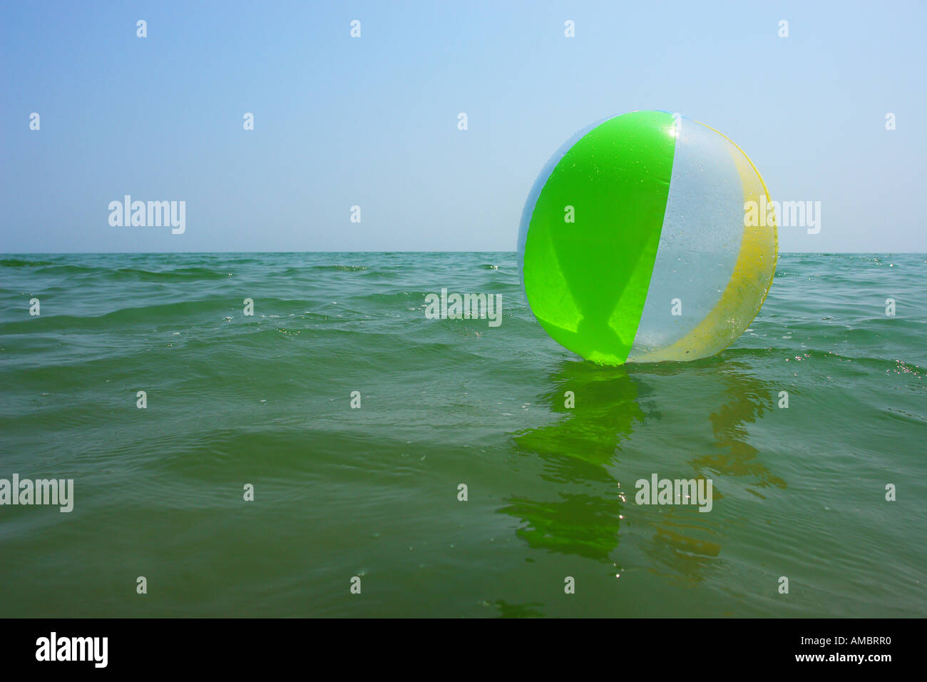 Beach ball at the ocean Stock Photo - Alamy