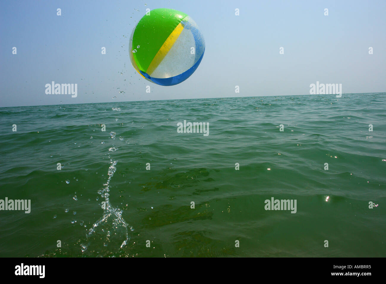 Beach ball at the ocean Stock Photo - Alamy