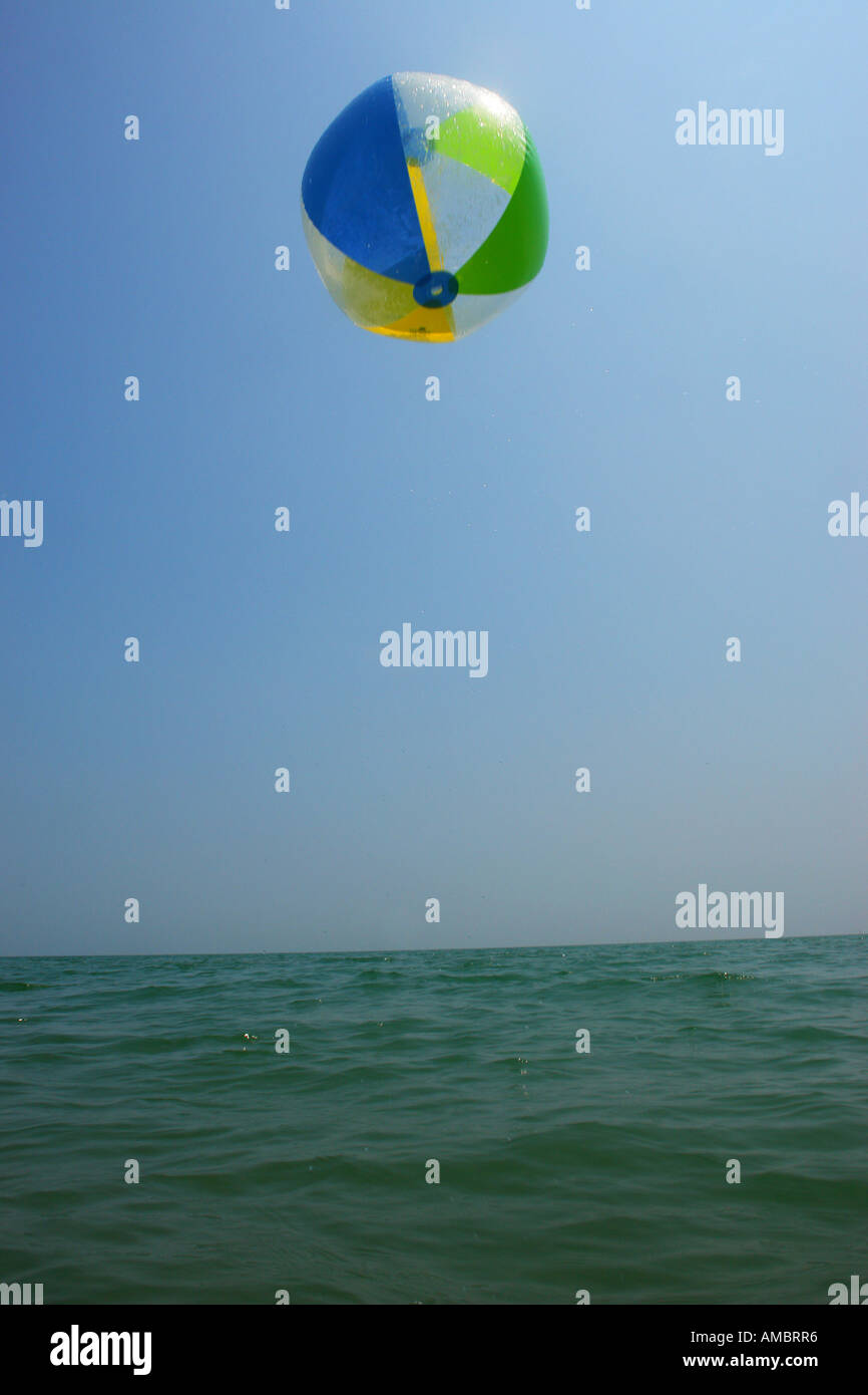 Beach ball at the ocean Stock Photo - Alamy