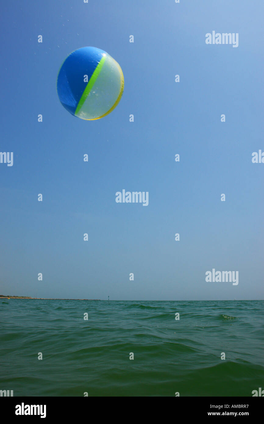 Beach ball at the ocean Stock Photo - Alamy