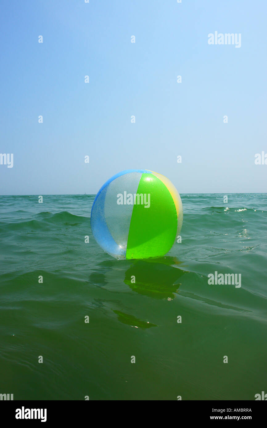 Beach ball at the ocean Stock Photo - Alamy