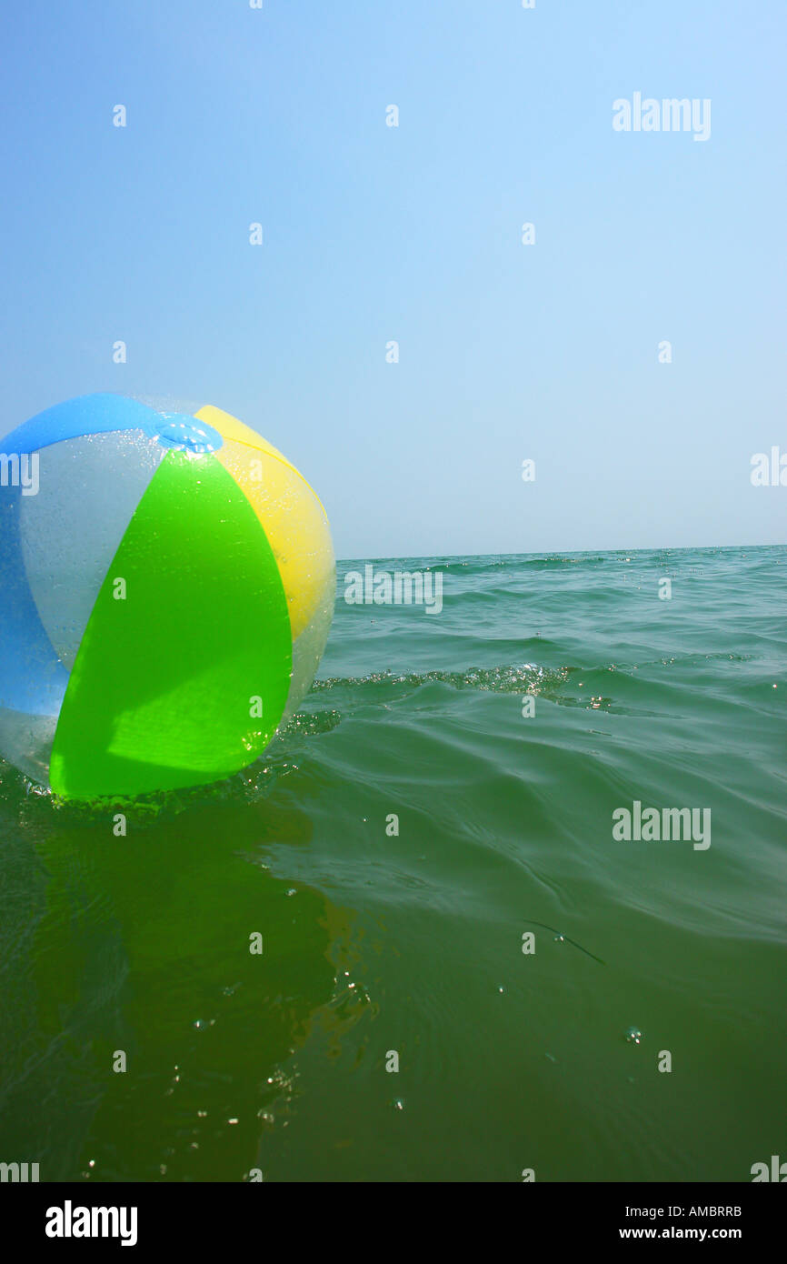 Beach ball at the ocean Stock Photo - Alamy