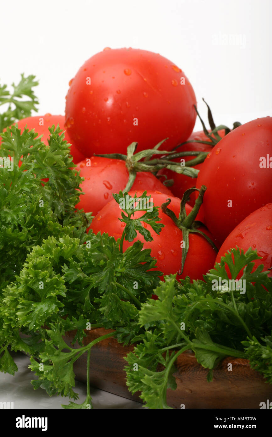 Fresh cherry tomatoes in a basket selling vegetables at American farmers market from above ...
