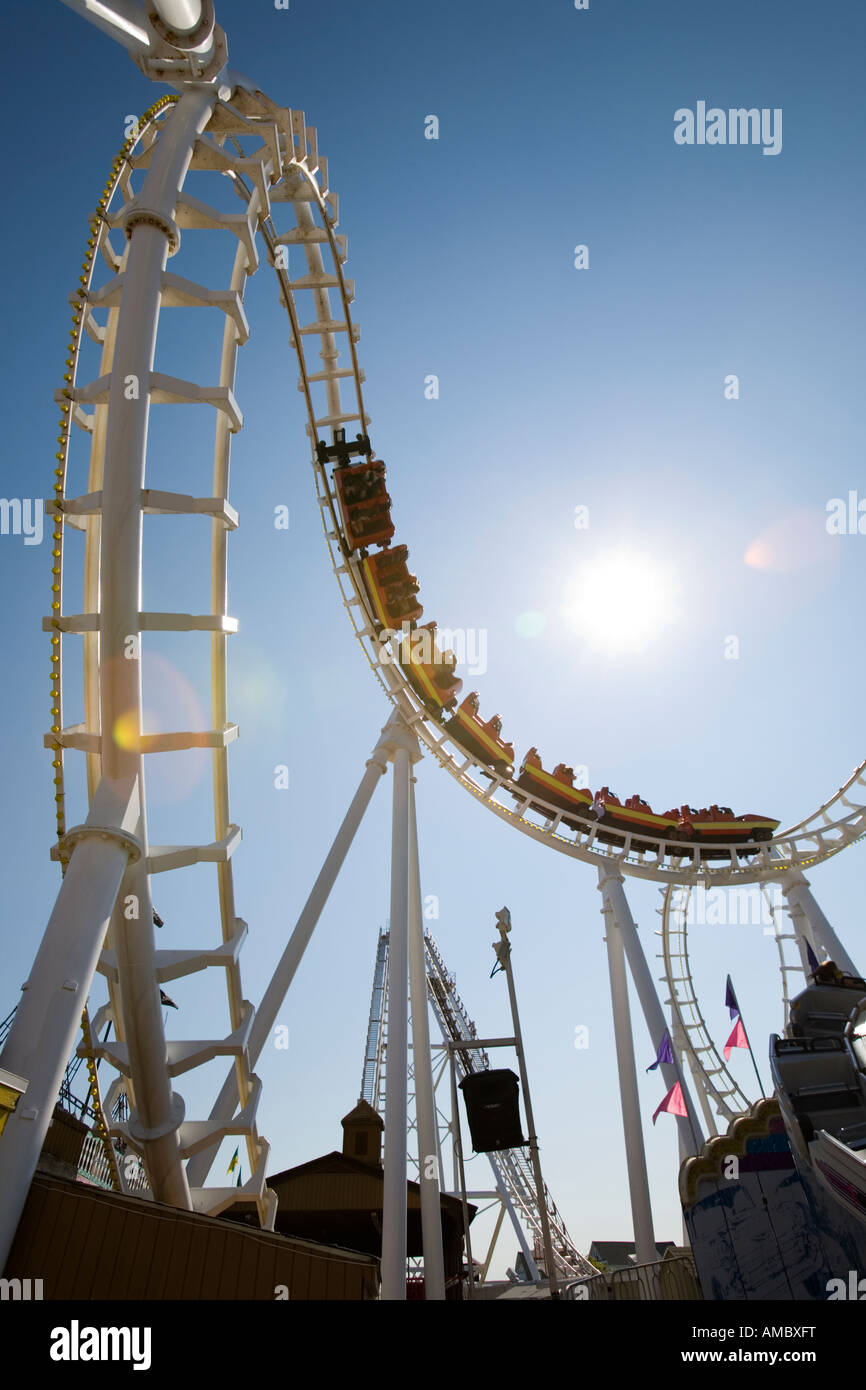 A roller coaster in action at an amusement park Stock Photo - Alamy