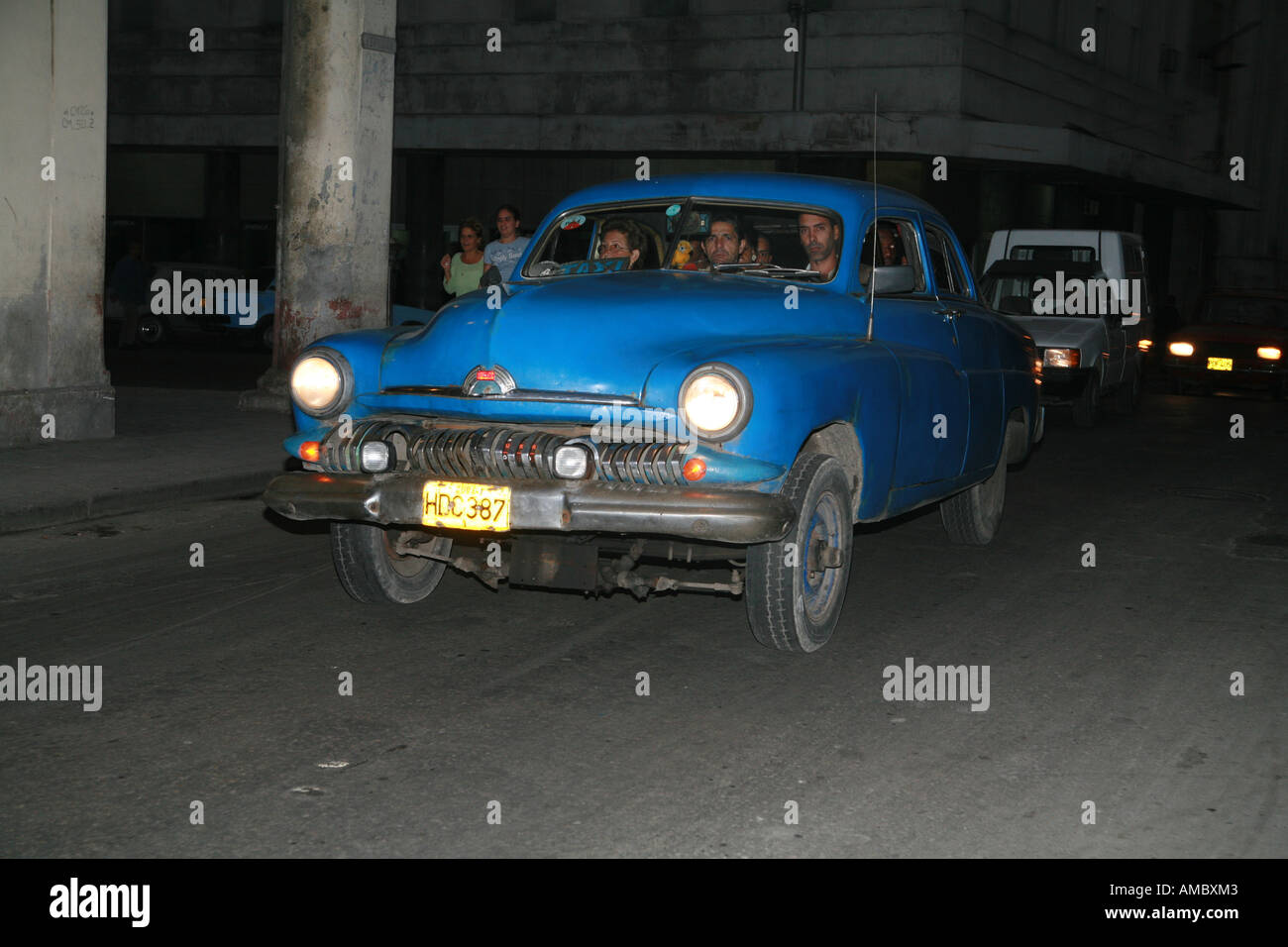 Cuba Havana nightscene a classic car driving through the night streets ...