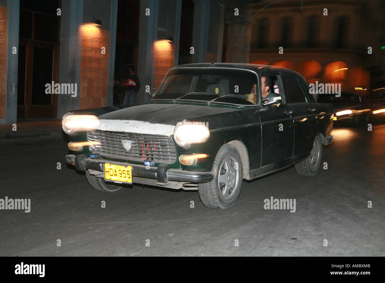 Cuba Havana nightscene a classic car driving through the night streets ...