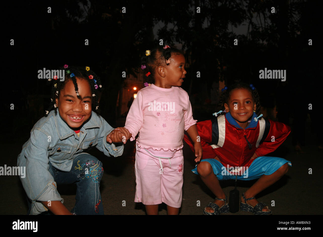 Cuba Havana nightscene three girls smiling Stock Photo - Alamy