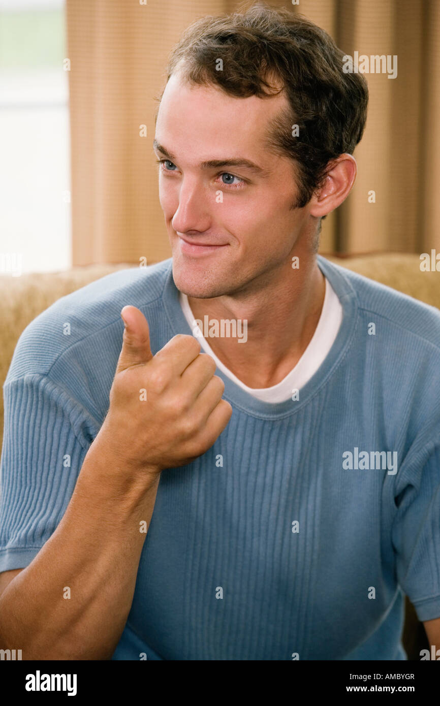 View of a young man communicating in sign language Stock Photo - Alamy