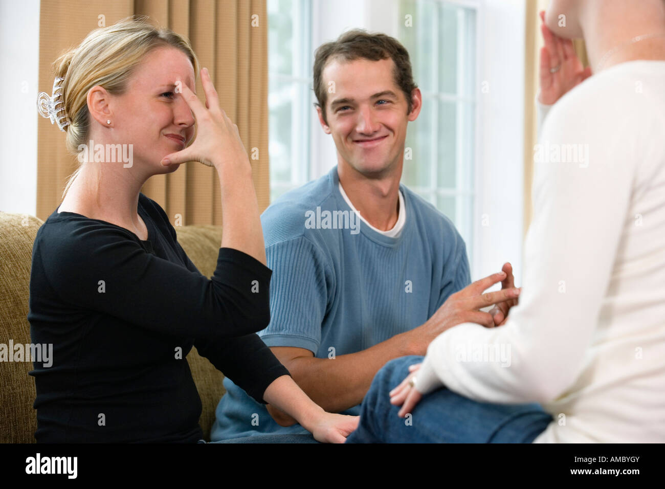 View of a family conversing in sign language Stock Photo - Alamy