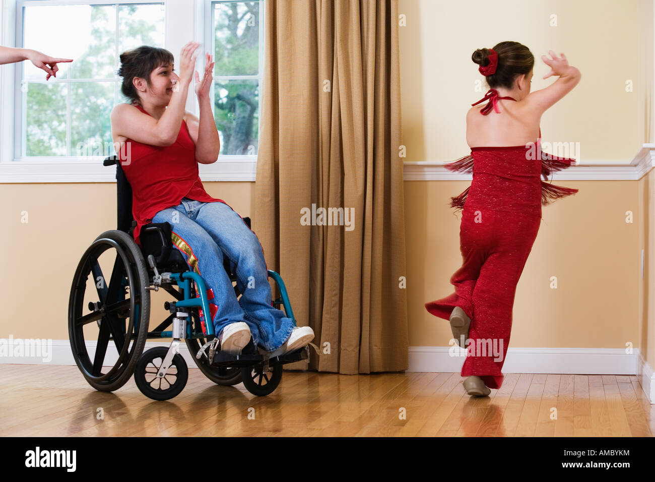 View of a handicapped woman cheering a girl with deformed hand Stock ...