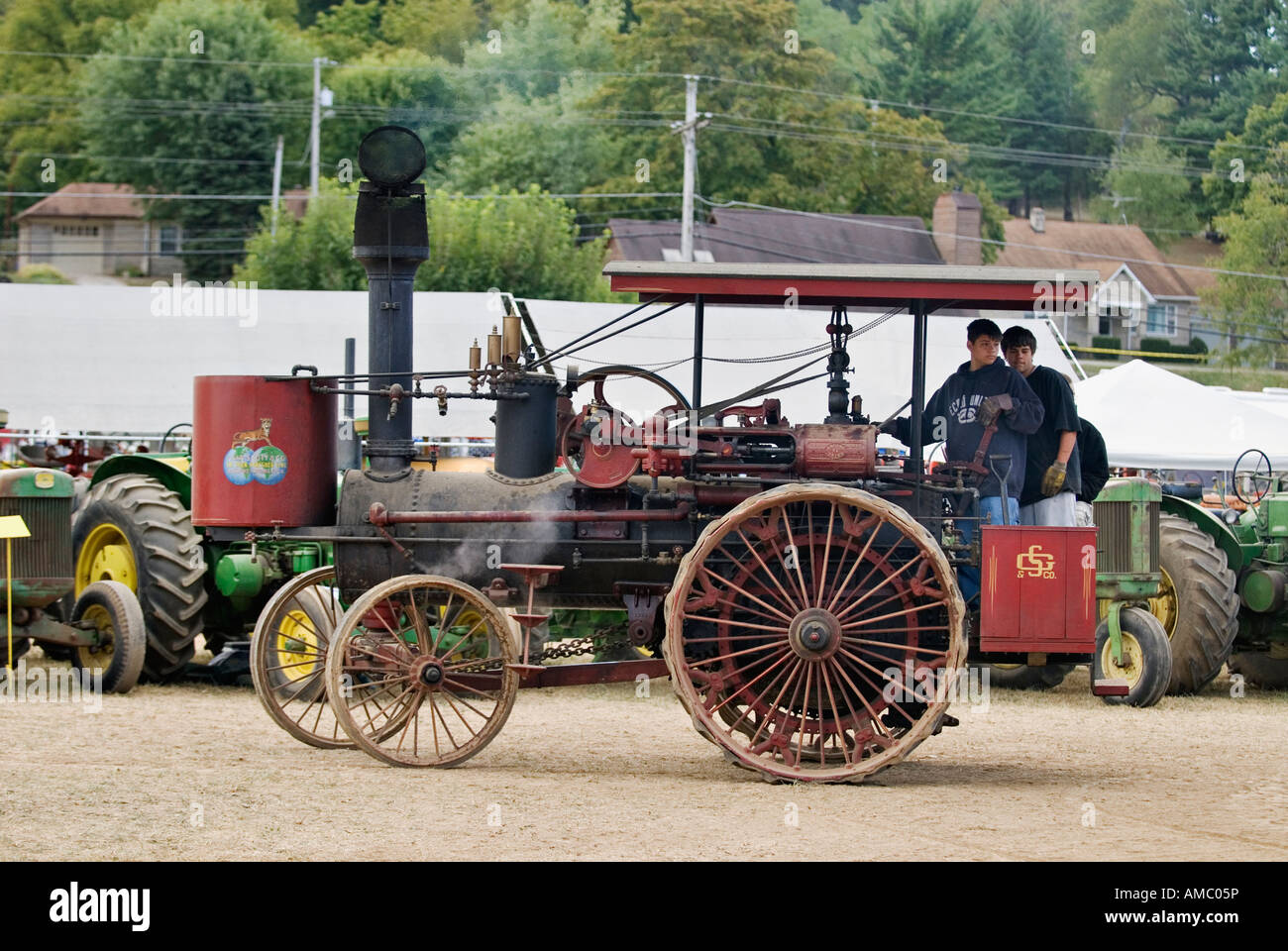 Two Boys Operating Antique Steam Tractor Stock Photo - Alamy