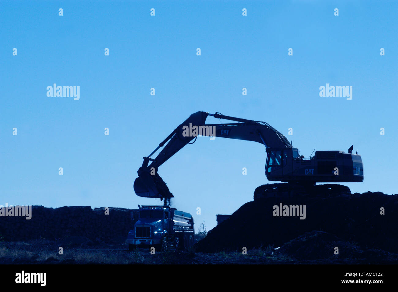 Construction Backhoe digging and working at Electric power Plant site ...