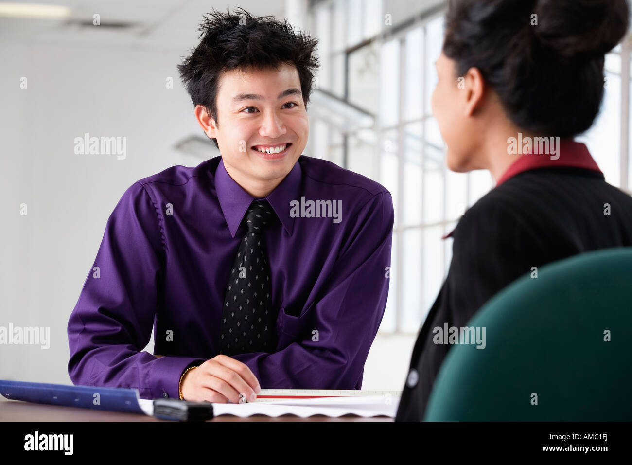 Two business executives discussing in office Stock Photo - Alamy