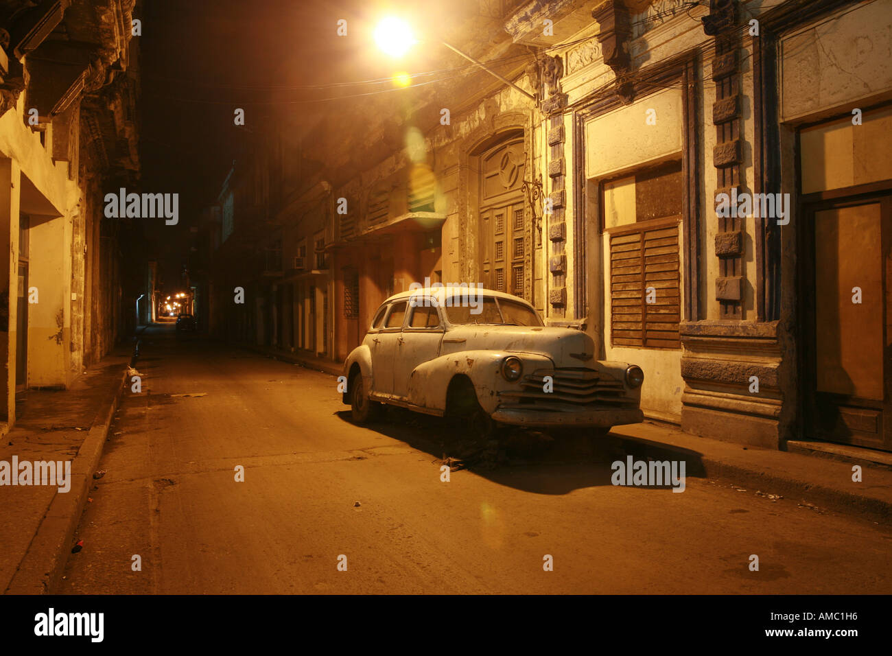 Cuba Havana Night street scene with classic car Stock Photo - Alamy