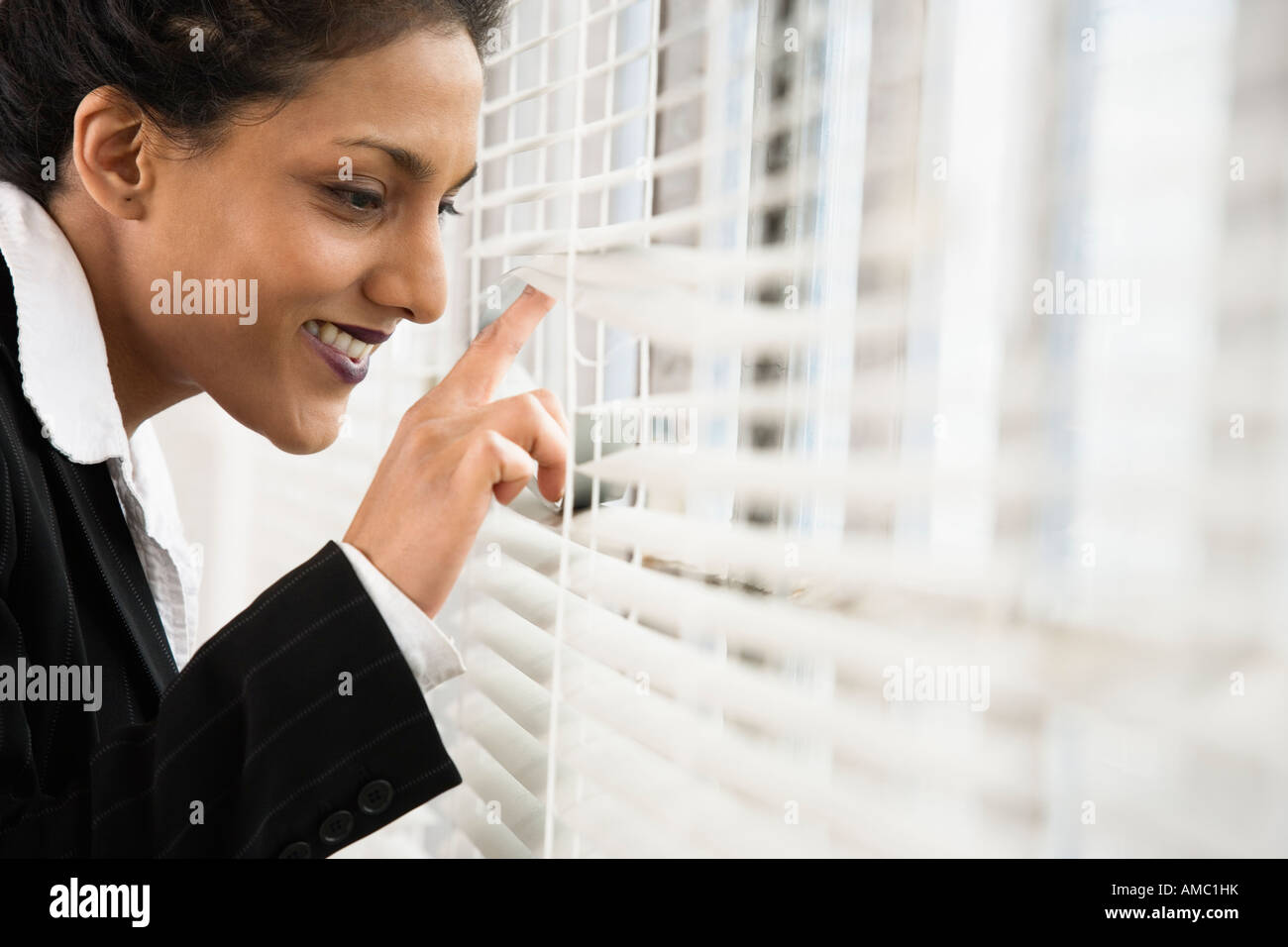 Peeping out window woman hi-res stock photography and images - Alamy