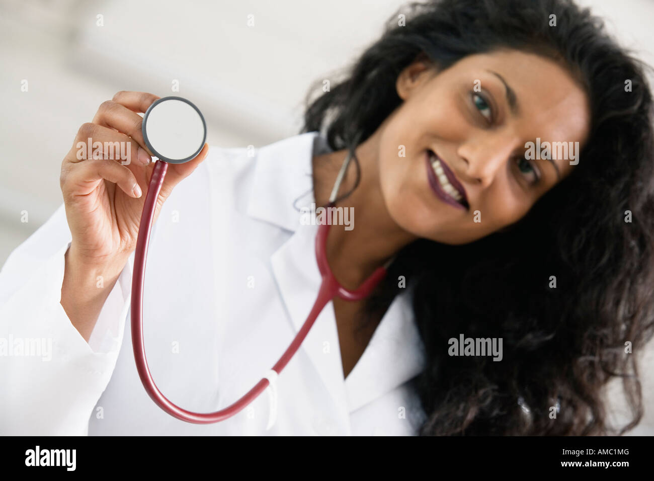 Nurse holding a stethoscope Stock Photo - Alamy