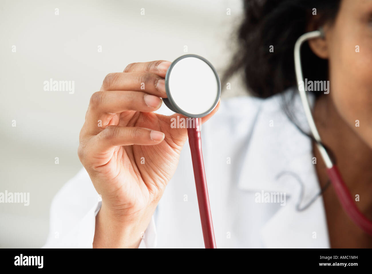 Nurse holding a stethoscope Stock Photo - Alamy