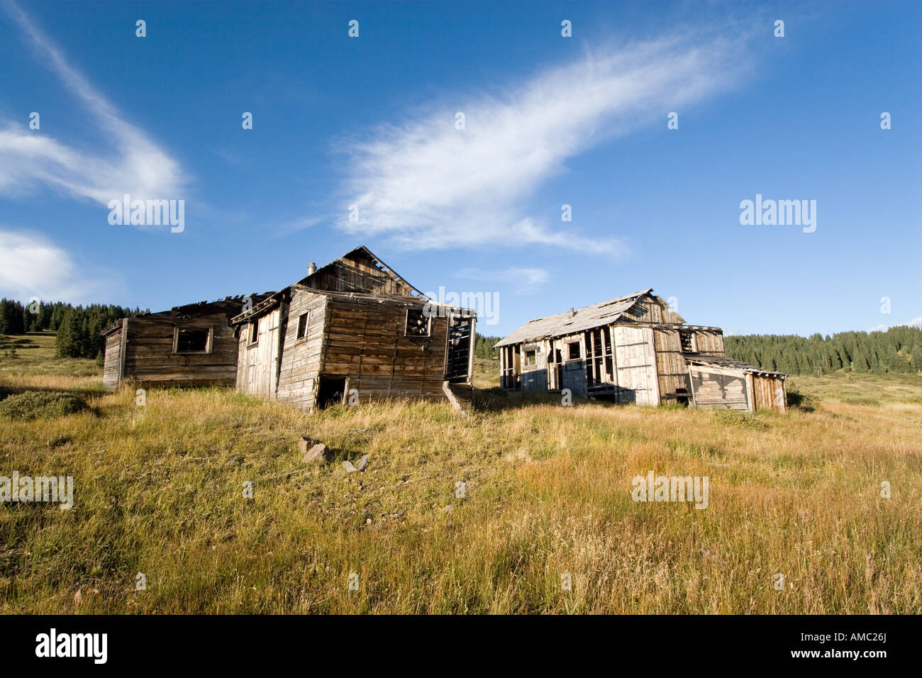 Slowly decaying wood buildings in the ghost town of Summitville in ...
