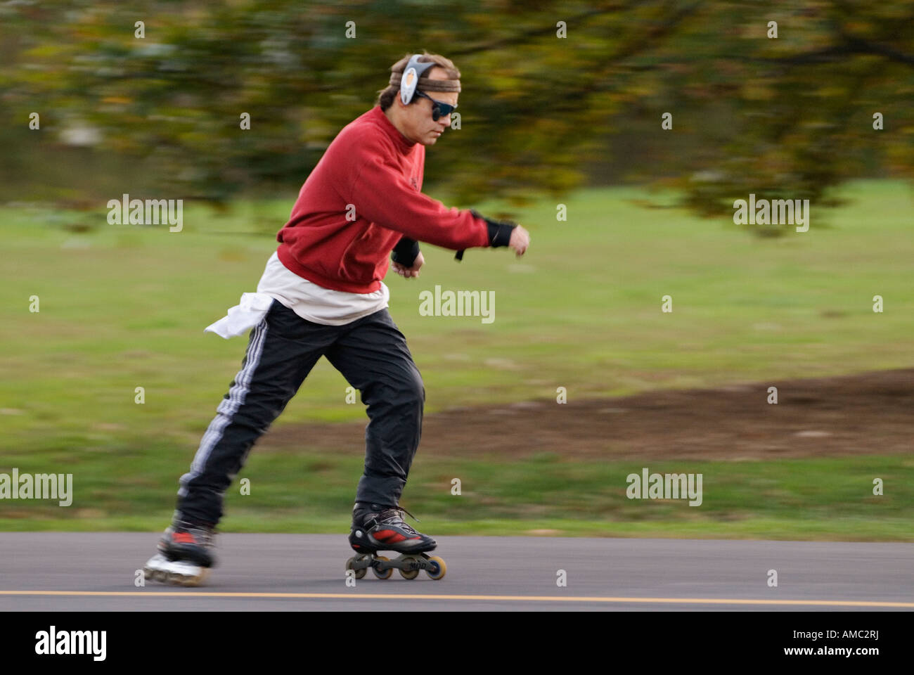Pan shot man rollerblading in hi-res stock photography and images - Alamy