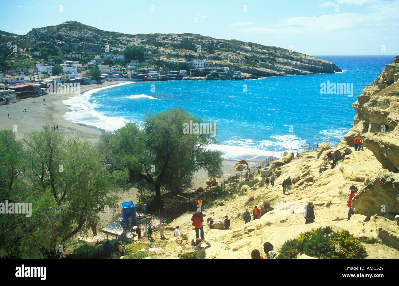 view of the town Matala from the limestone caves on the Greek Island of ...