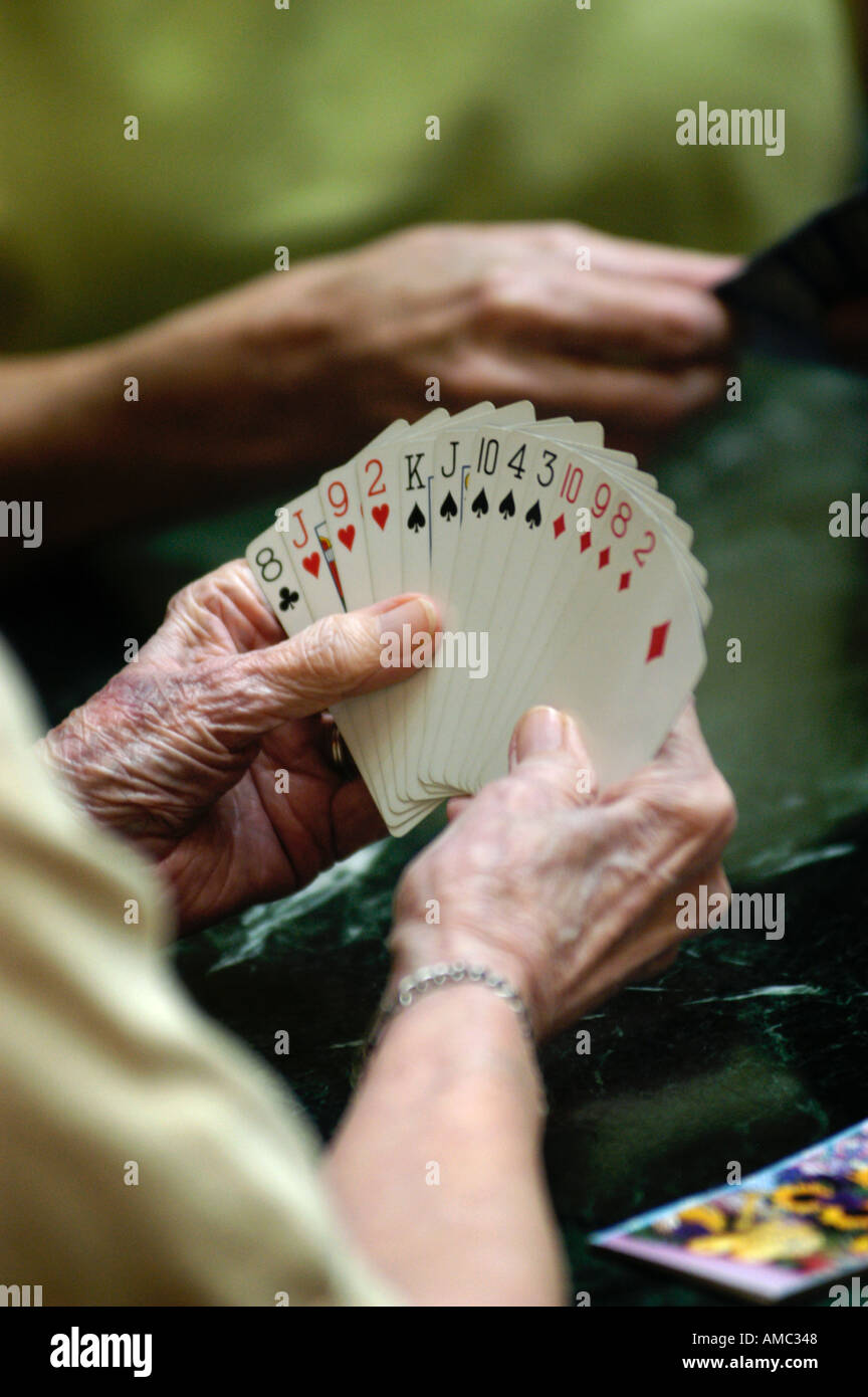senior friend in club of all Women Playing Bridge Game of Cards, in ...