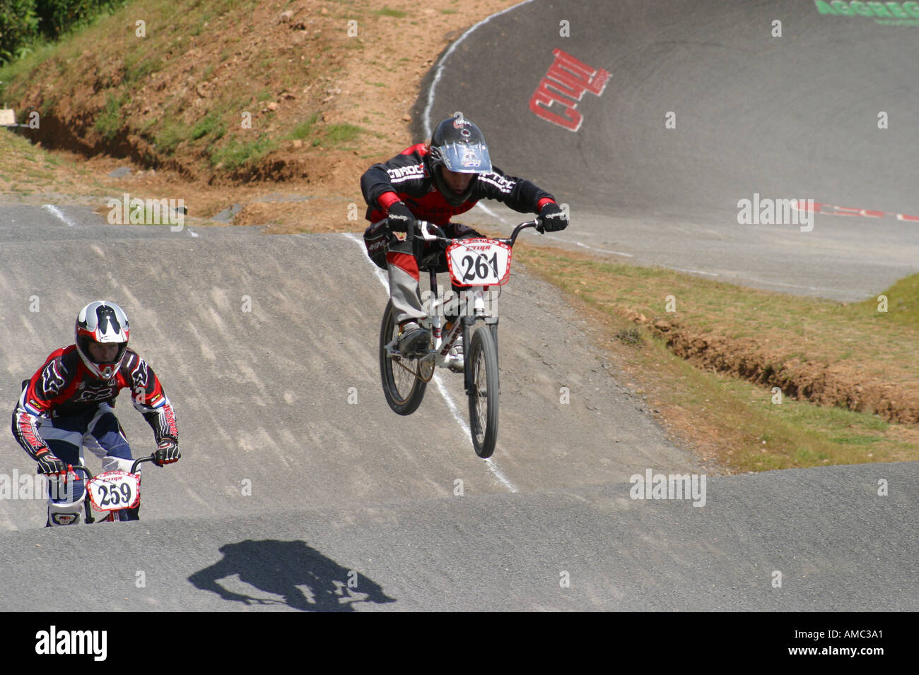 Jumping through the air during a youth BMX cycle competition Stock ...