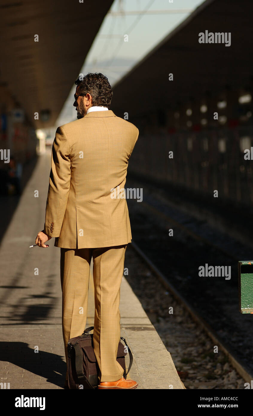 Italian man smoking a cigarette in florence hi-res stock photography ...
