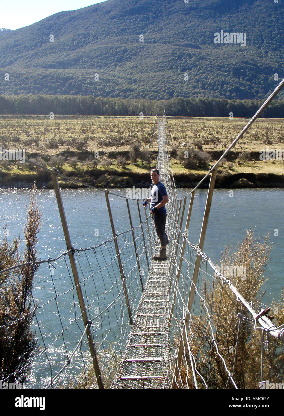 Young Toby Nicholls on a swing bridge Sumner Lake New Zealand Stock ...