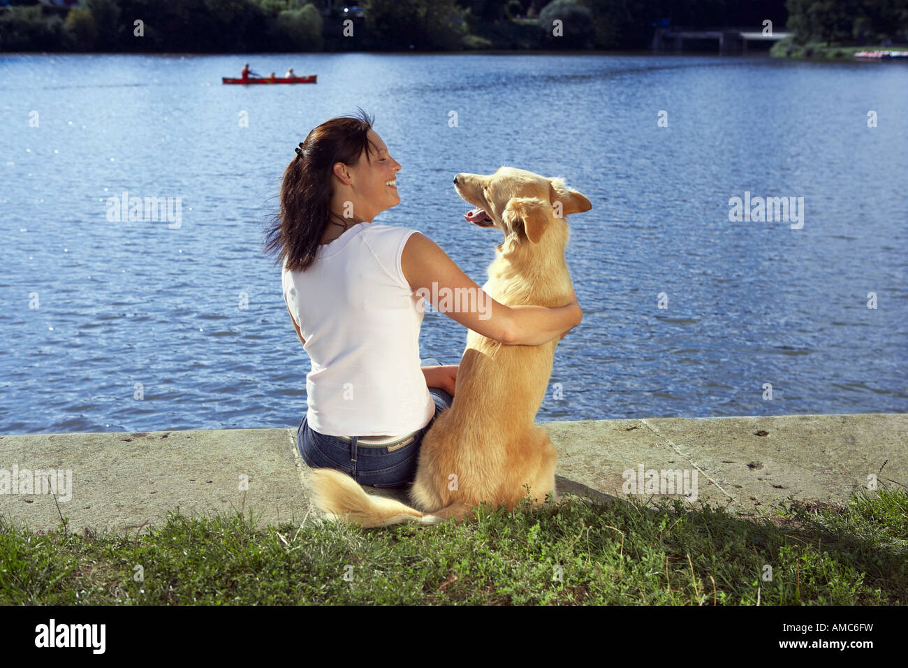 woman and half breed dog at the shore Stock Photo - Alamy