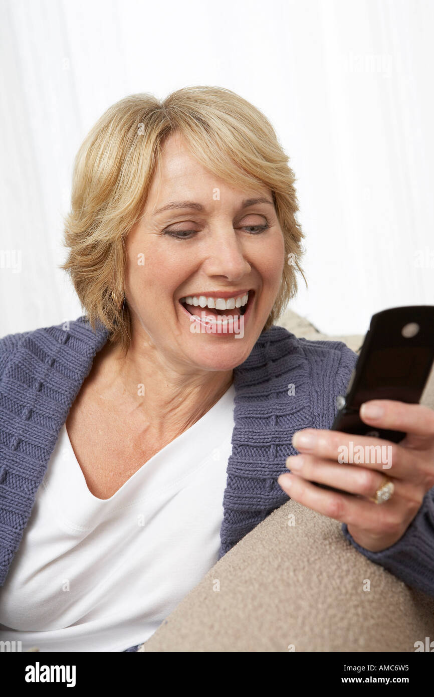 Mature Woman Using Cell Phone Stock Photo - Alamy