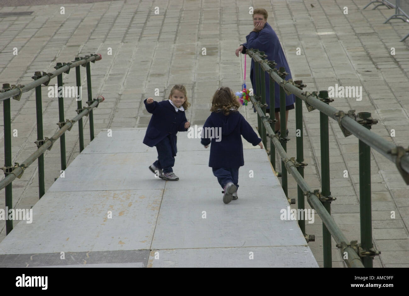 Children going down the ramp walkway of a ship in Venice Italy Stock ...