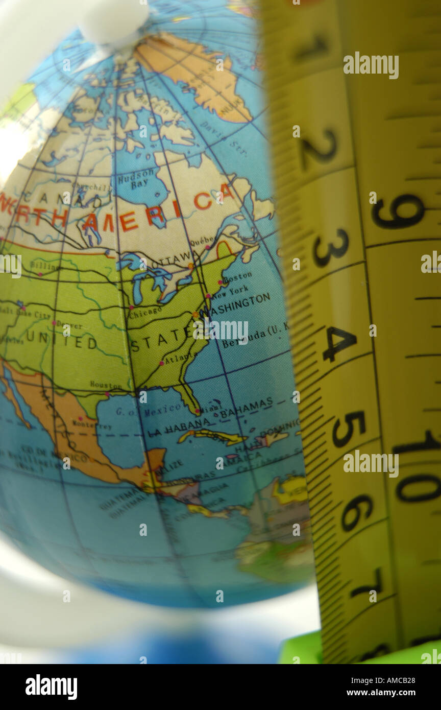 Measuring small globe with a yellow measure tape diagonal Stock Photo ...