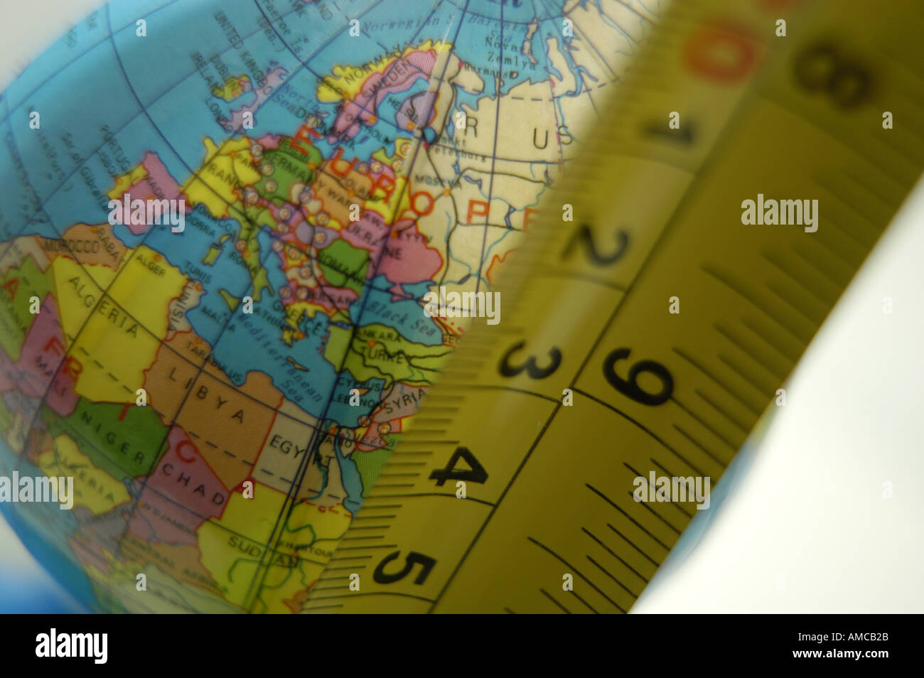Measuring small globe with a yellow measure tape straight Stock Photo ...