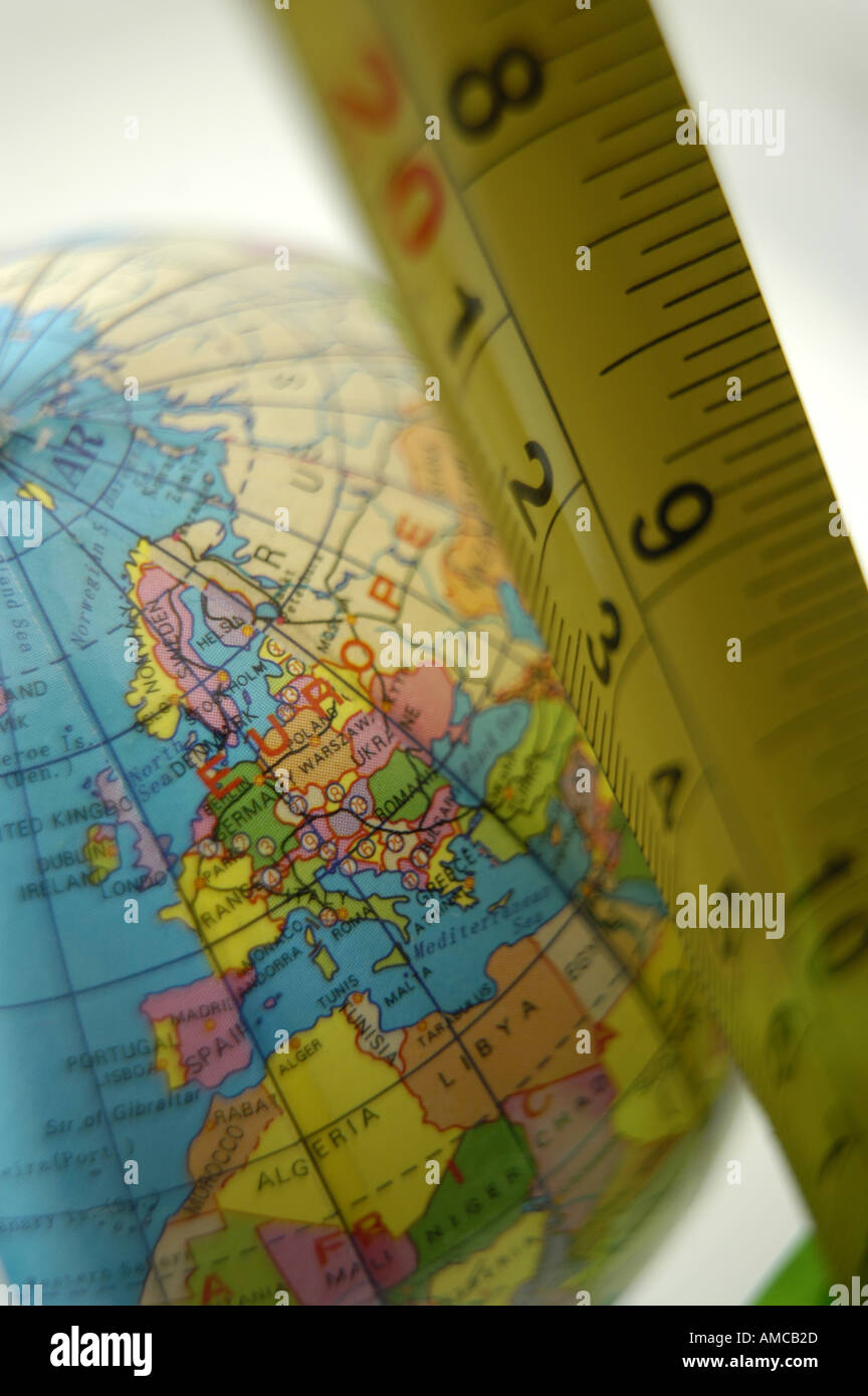 Measuring small globe with a yellow measure tape diagonal Stock Photo ...