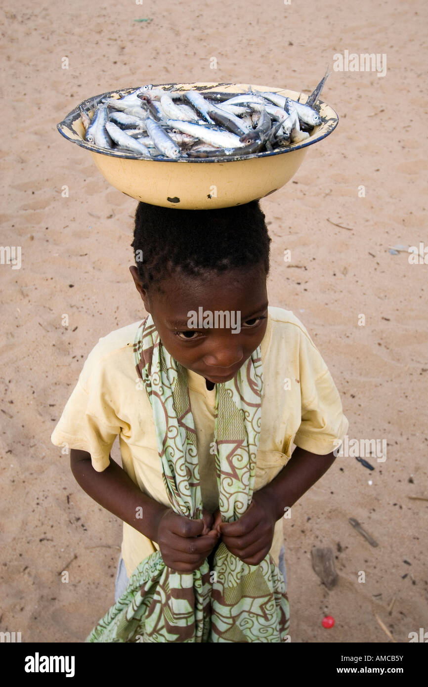 girl with bowl fish on head Stock Photo - Alamy