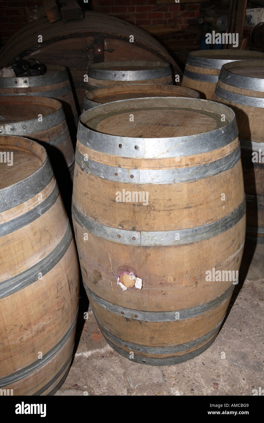 Wine barrels stacked together after repairs, ready for delivery ...