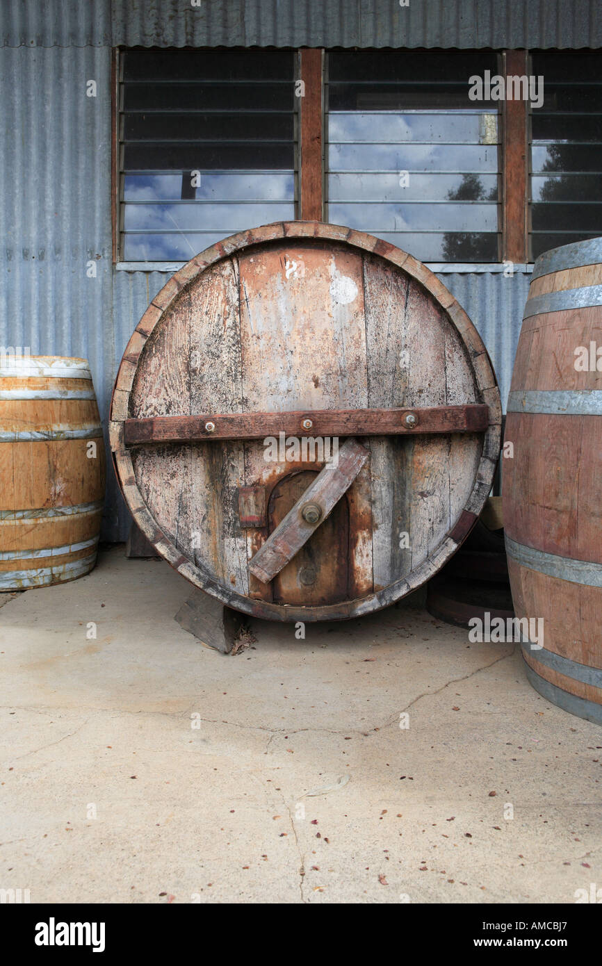 Head and door of large cask lying on its side next to vertical cask and ...